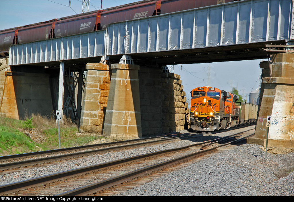 BNSF 6250 Leads a Wb under a grain train on the ottumwa Sub.